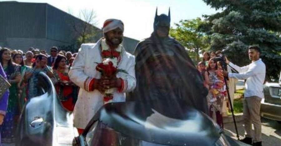 Groom makes big wedding entrance with Batman at his side